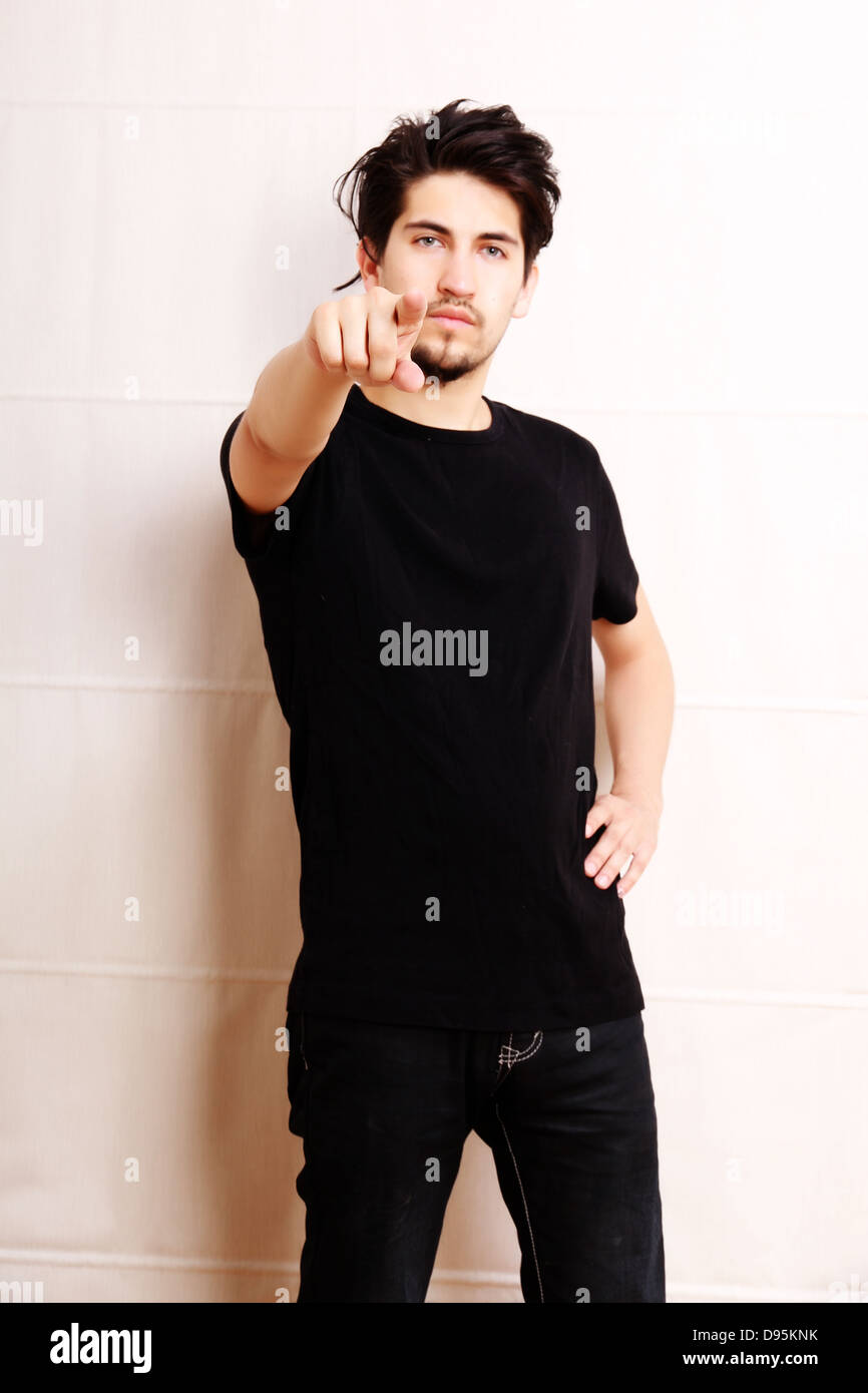 A young man pointing at you. Focus on Finger Stock Photo - Alamy