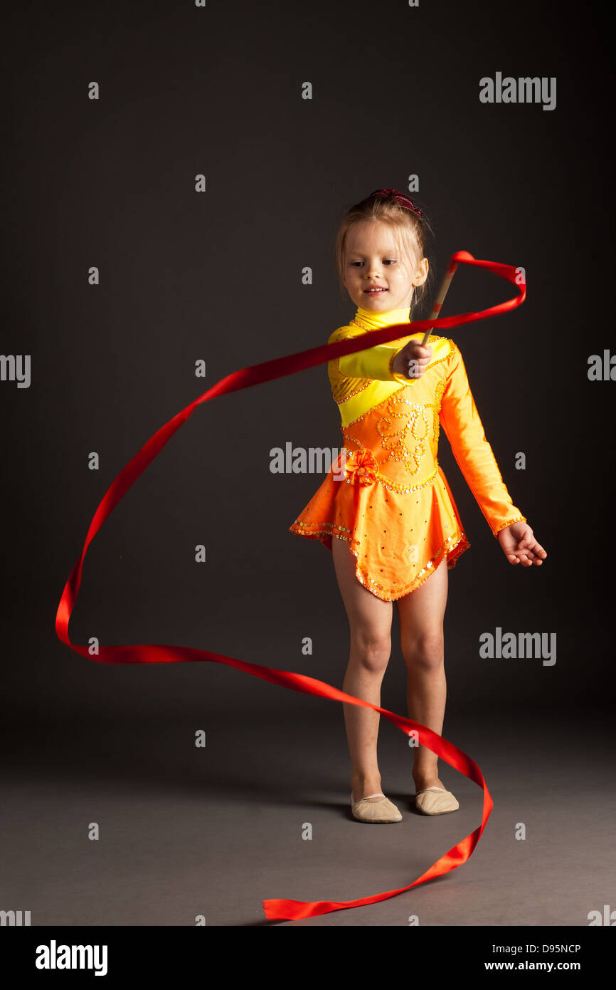 little girl doing rhythmic gymnastics with ribbon Stock Photo - Alamy