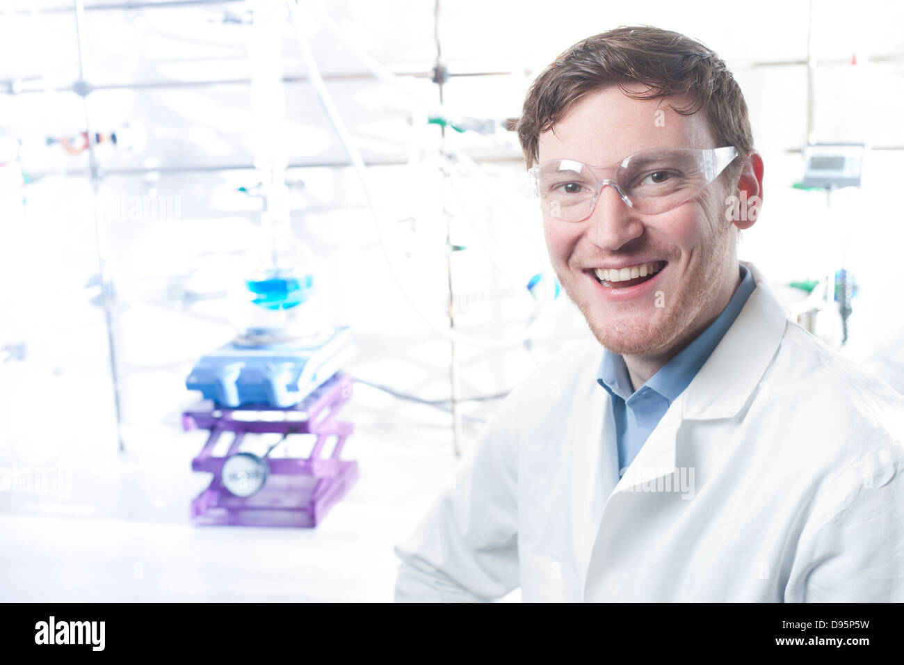 Germany, Portrait of young scientist smiling Stock Photo - Alamy