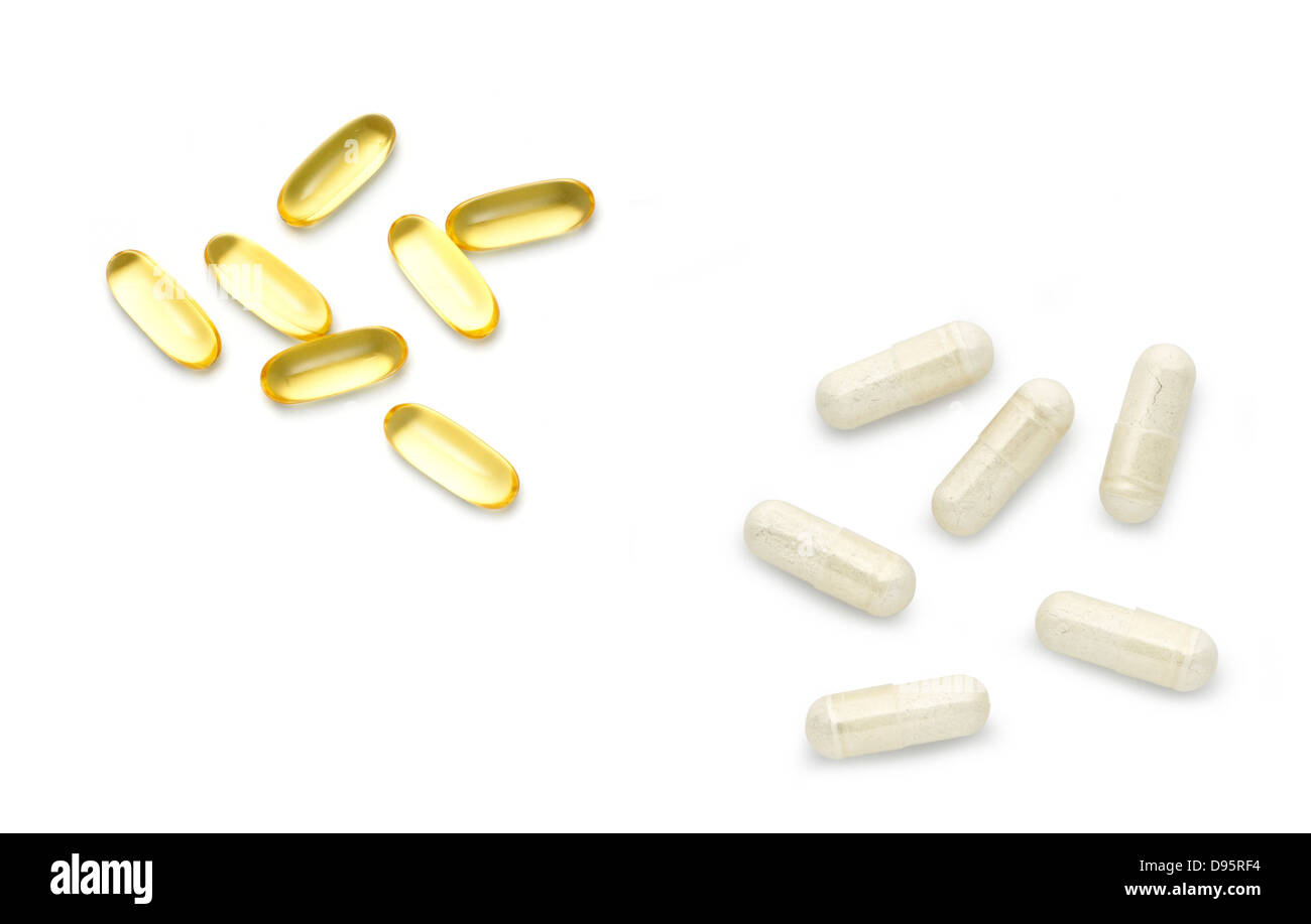 capsules cut out onto a white background Stock Photo - Alamy
