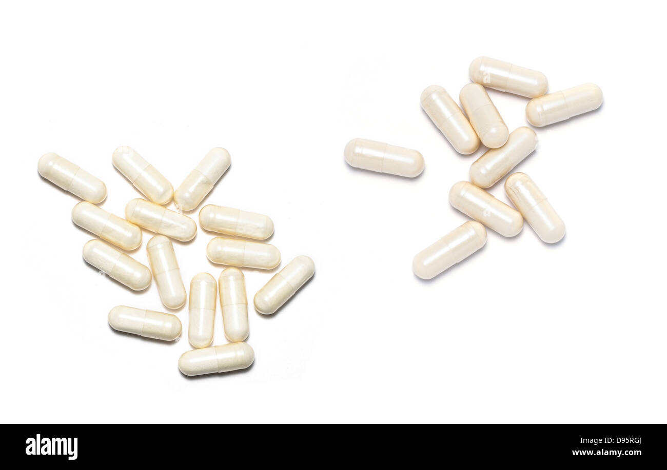 white capsules cut out onto a white background Stock Photo - Alamy