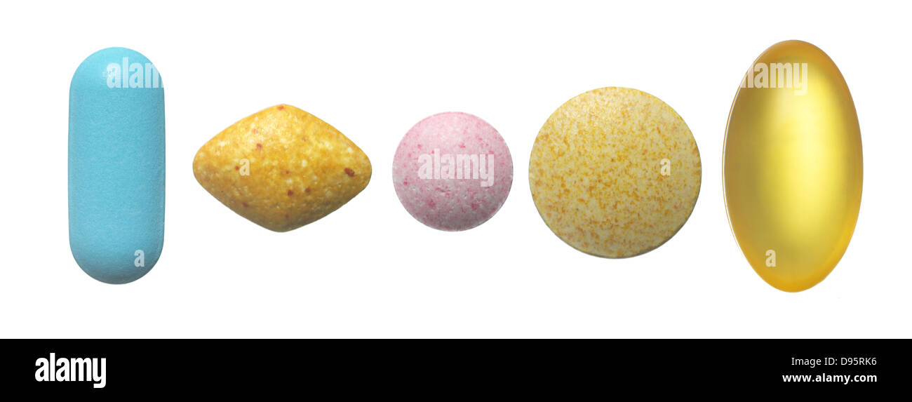 row of vitamins cut out onto a white background Stock Photo - Alamy