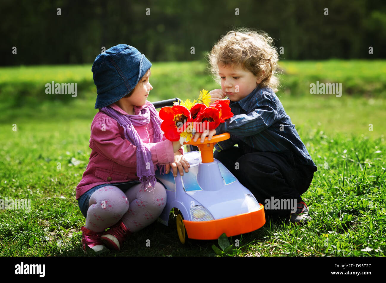 cute boy and girl on date in park Stock Photo - Alamy