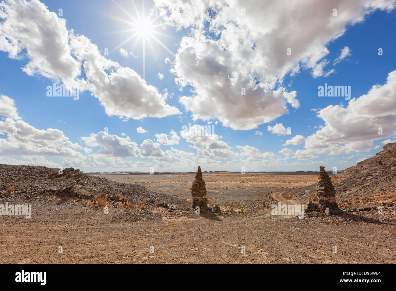 Stony desert with cloudy blue sky Stock Photo - Alamy