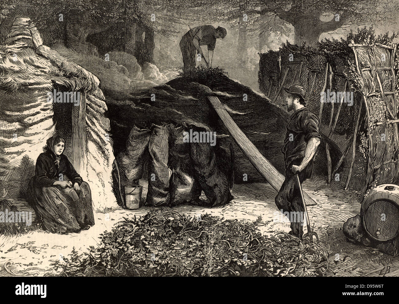 Charcoal burners in Epping Forest, Essex, near London, England. The men ...