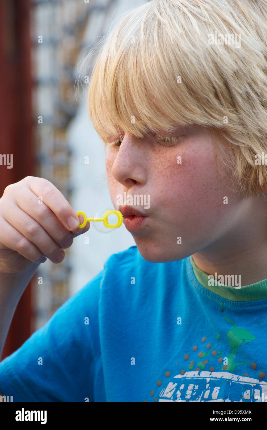 boy blowing bubbles Stock Photo - Alamy