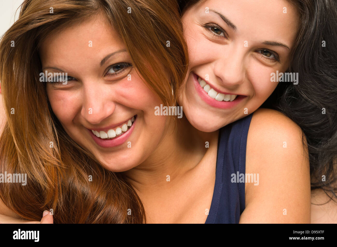 Close up portrait of beautiful girls hugging and smiling Stock Photo ...