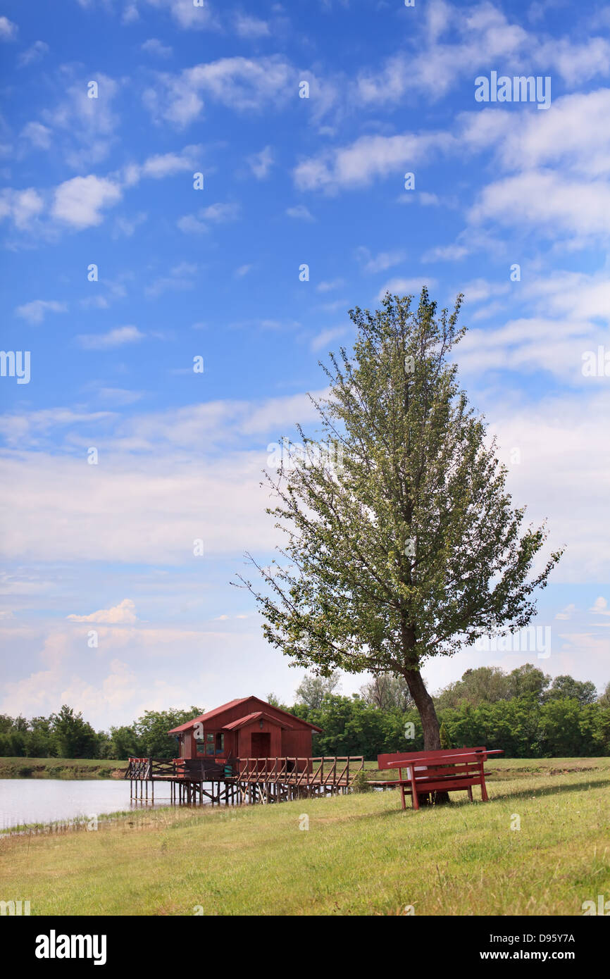 vertical bulgarian nature landscape with lake and house Stock Photo - Alamy