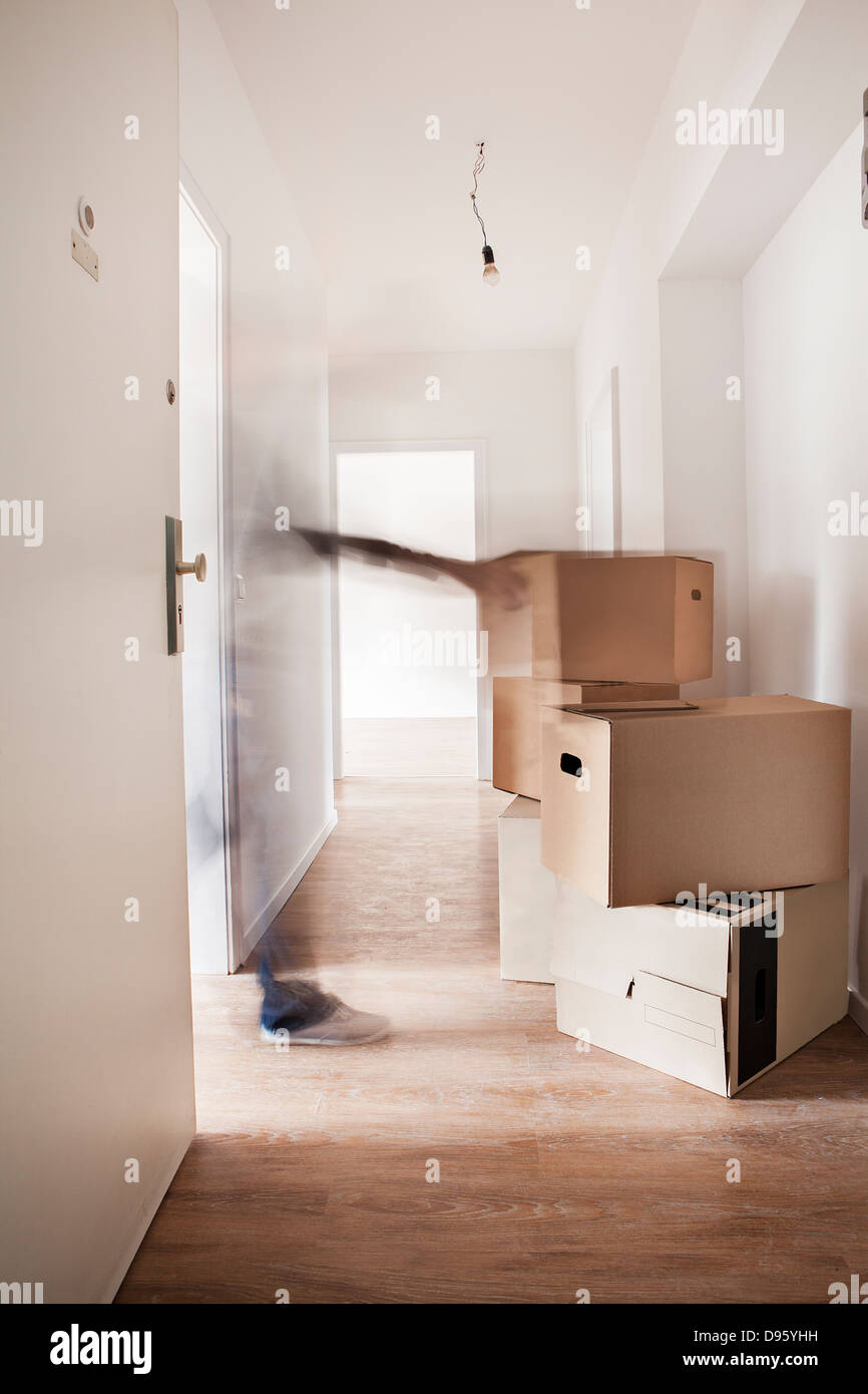 Stack of cardboard boxes in new house Stock Photo - Alamy