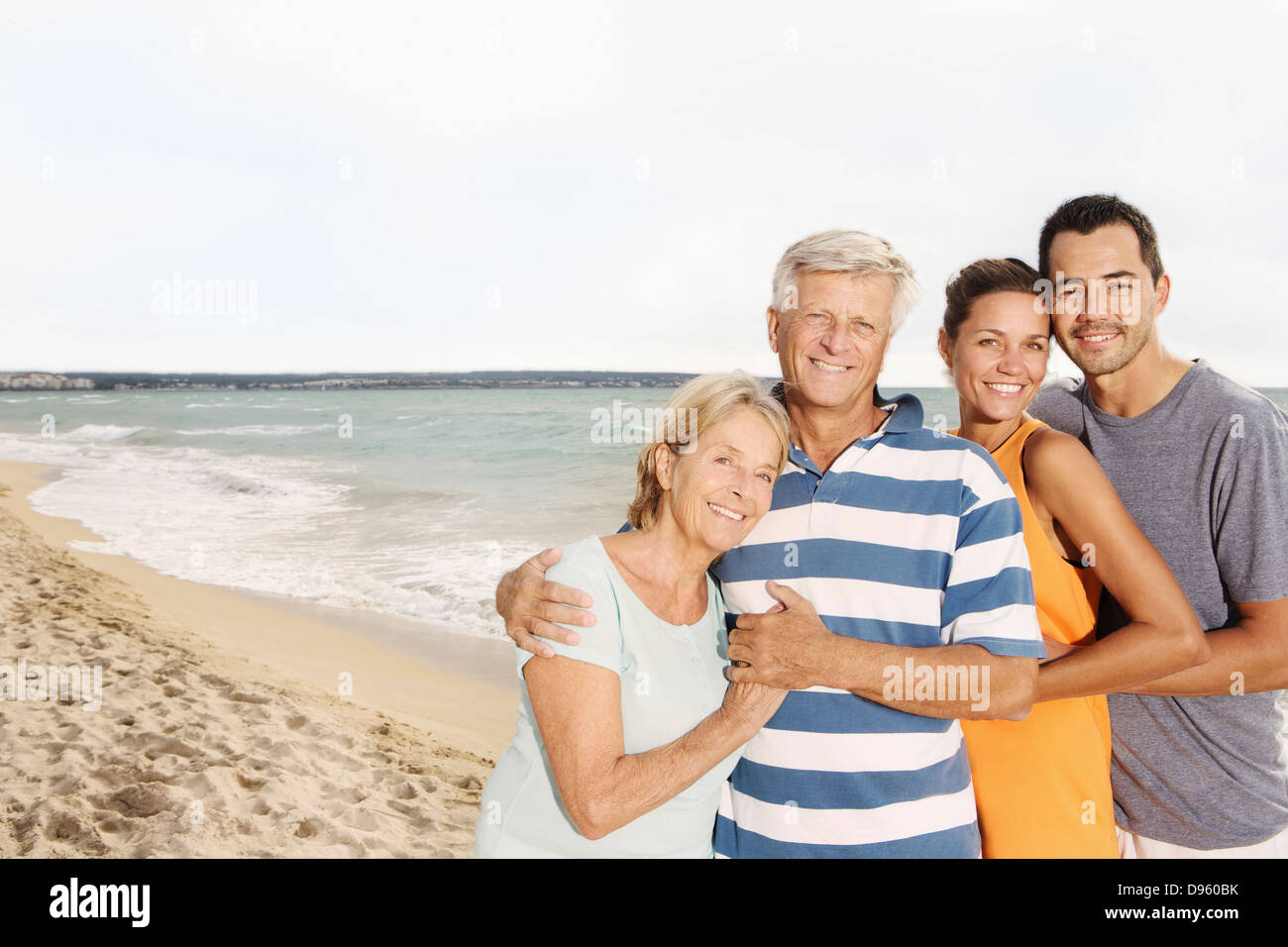 Spain, Family on beach at Palma de Mallorca, smiling Stock Photo - Alamy