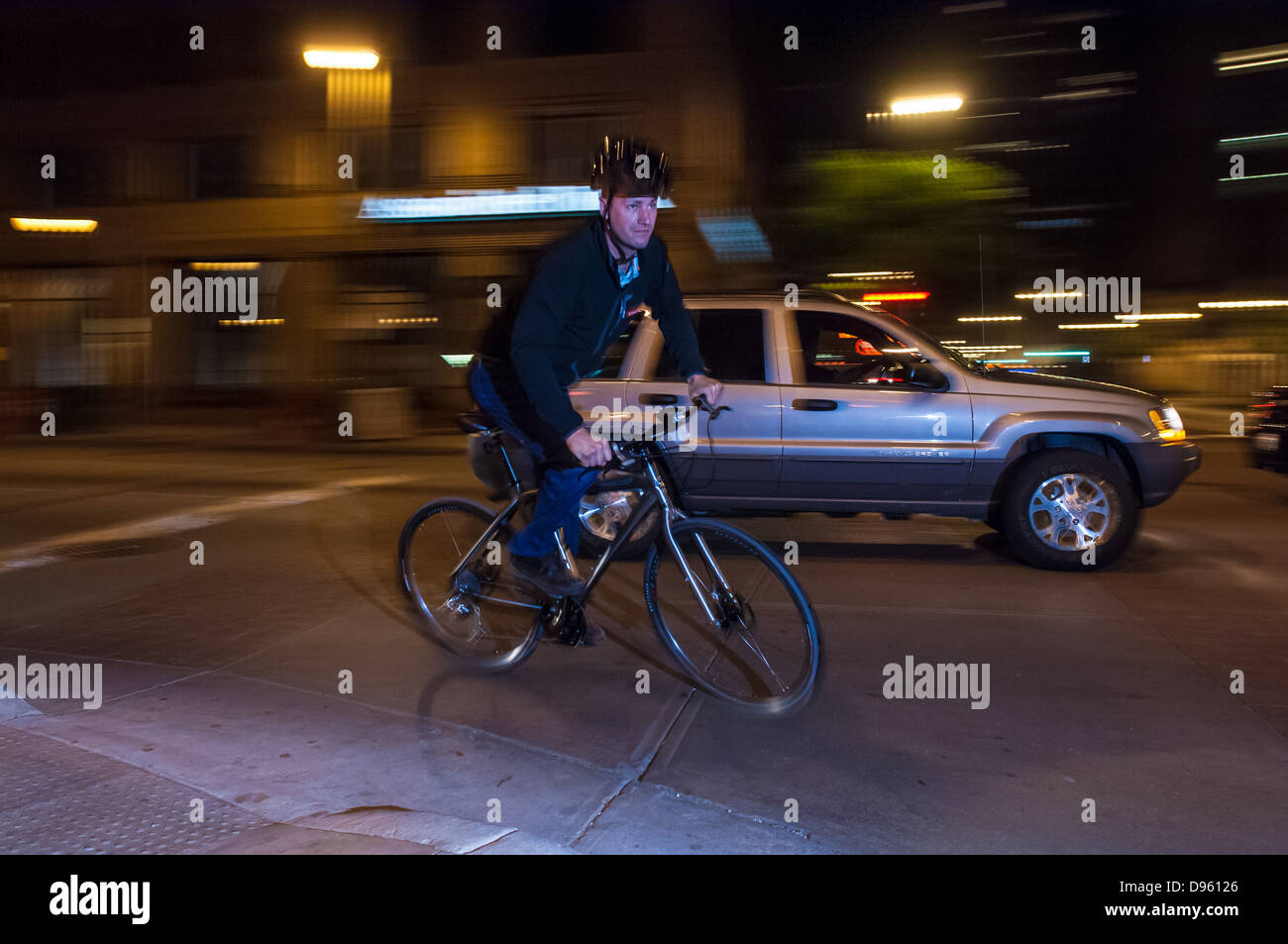 Night time inner city bicycle riding Stock Photo - Alamy