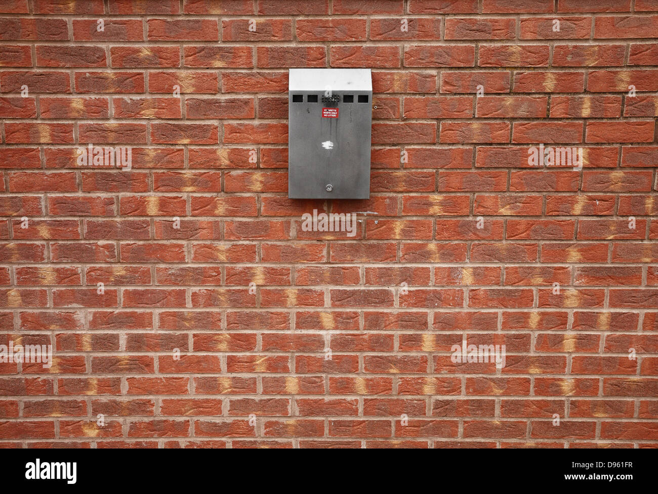Ashtray outside on a brick wall Stock Photo - Alamy