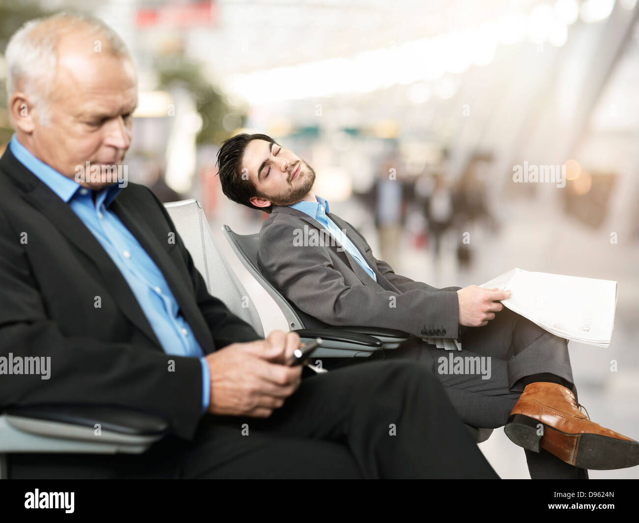 Businessman sleeping in airport hi-res stock photography and images - Alamy