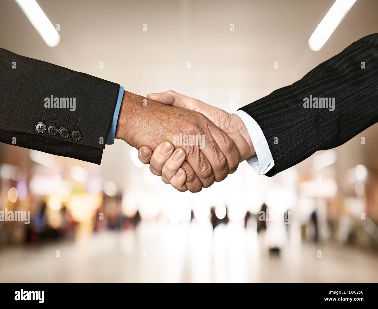 Businessmen shaking hands Stock Photo - Alamy