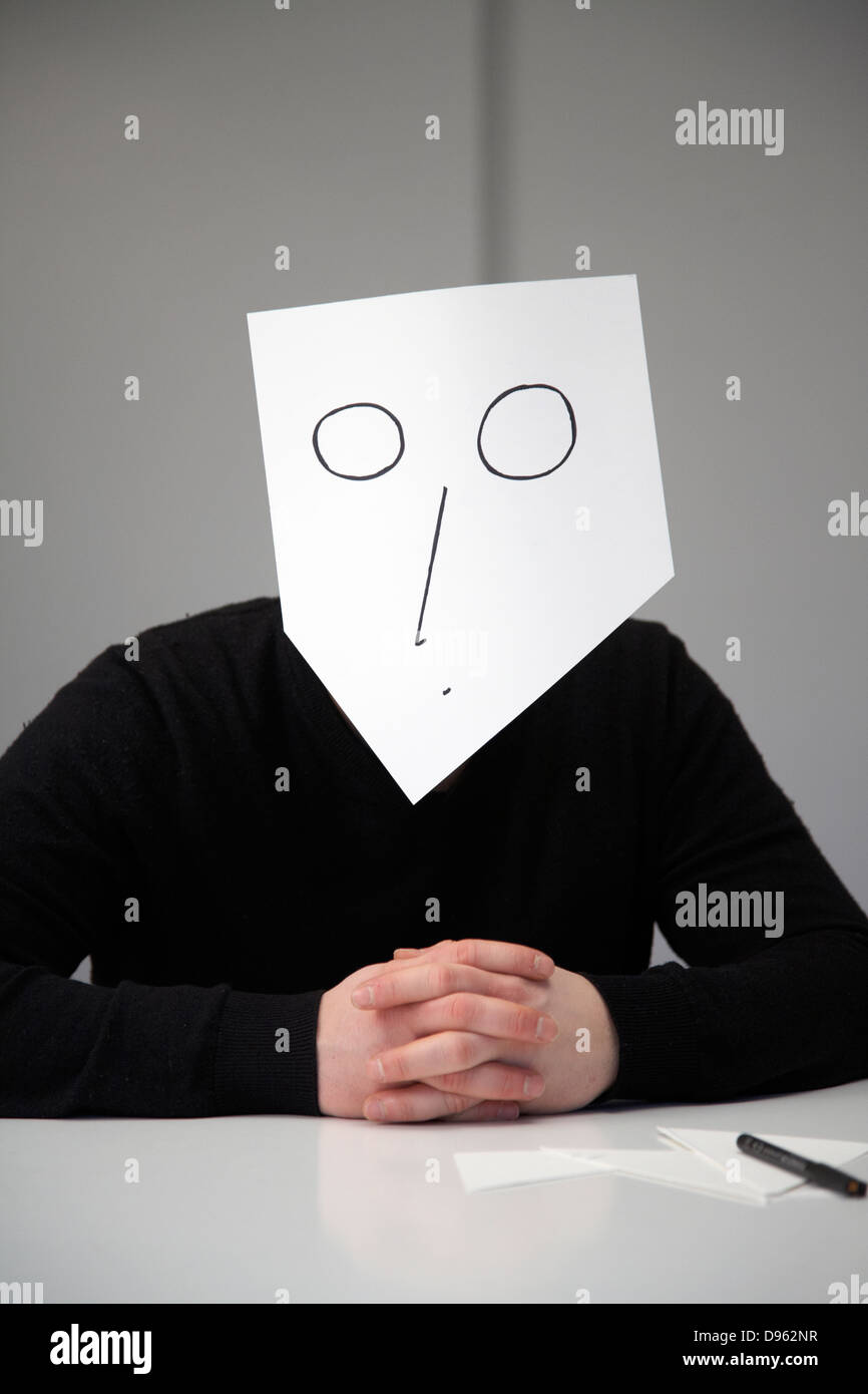 Man covering face with mask Stock Photo - Alamy