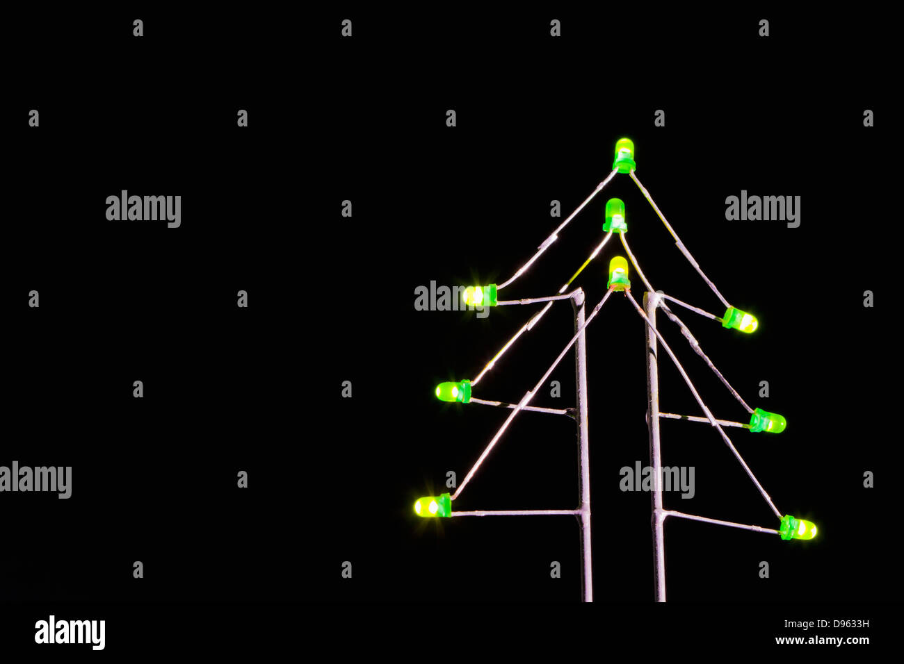 Christmas tree illuminating with diodes on black background, close up ...