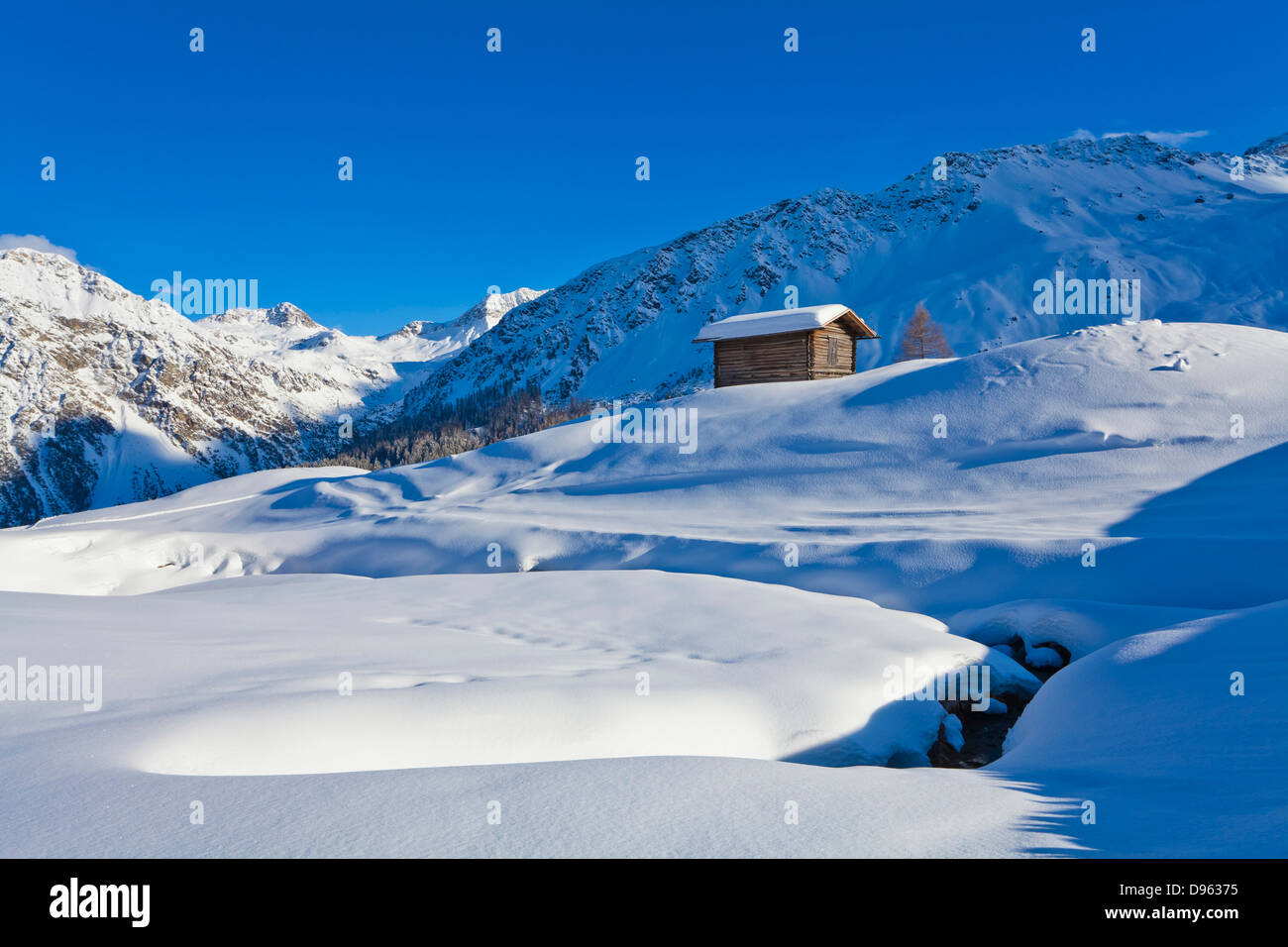 Switzerland, View of hut in snow Stock Photo - Alamy