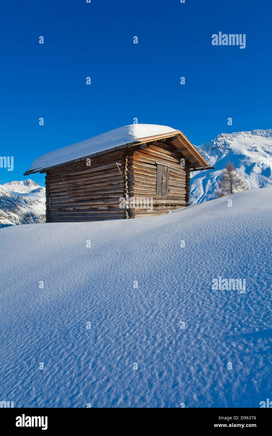 Switzerland, View of hut in snow Stock Photo - Alamy