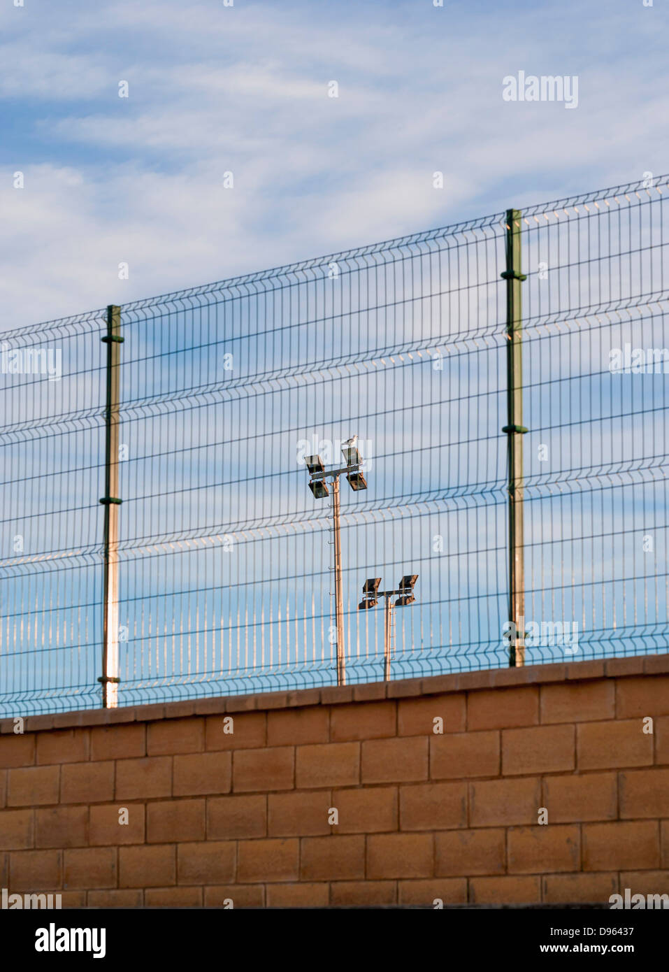 Spain, View of fence with floodlight Stock Photo - Alamy