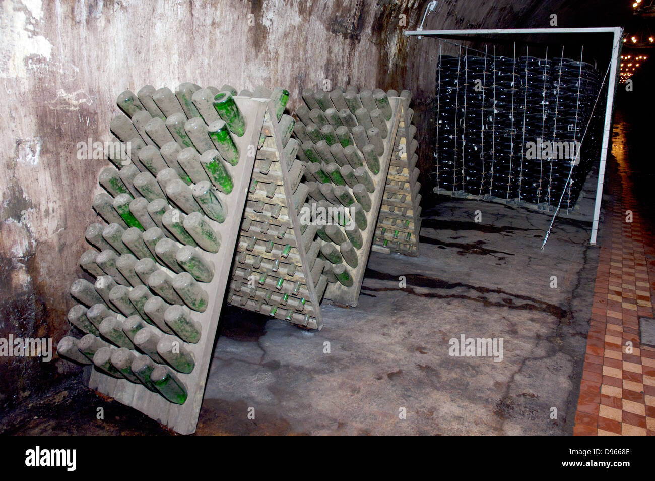 Stack of wine bottles in winery. Shampagne wine storage Stock Photo - Alamy