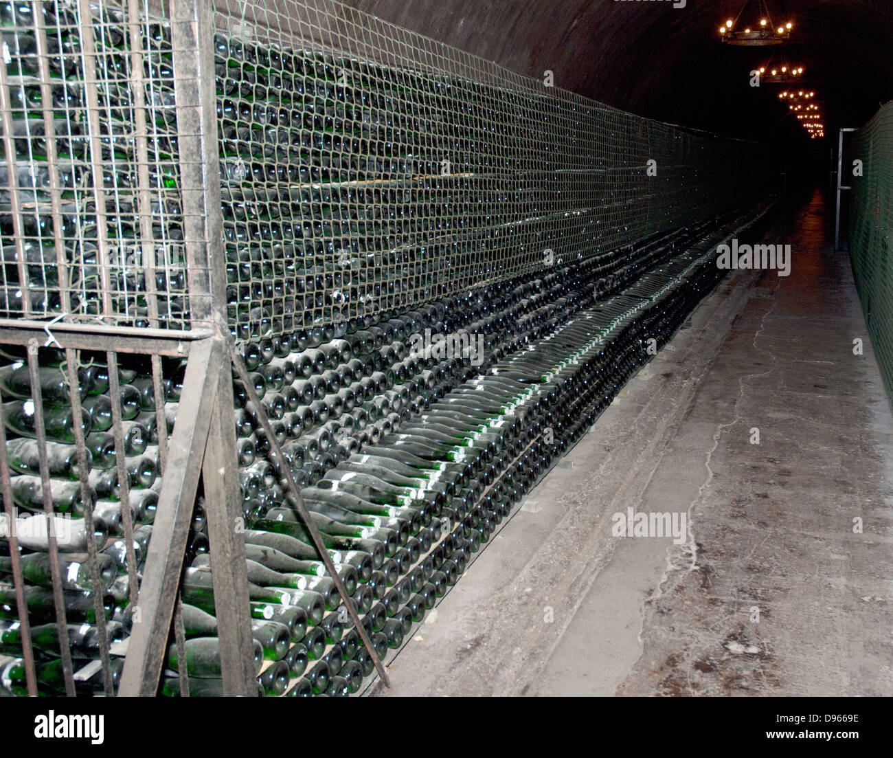 Stack of wine bottles in winery. Shampagne wine storage Stock Photo - Alamy