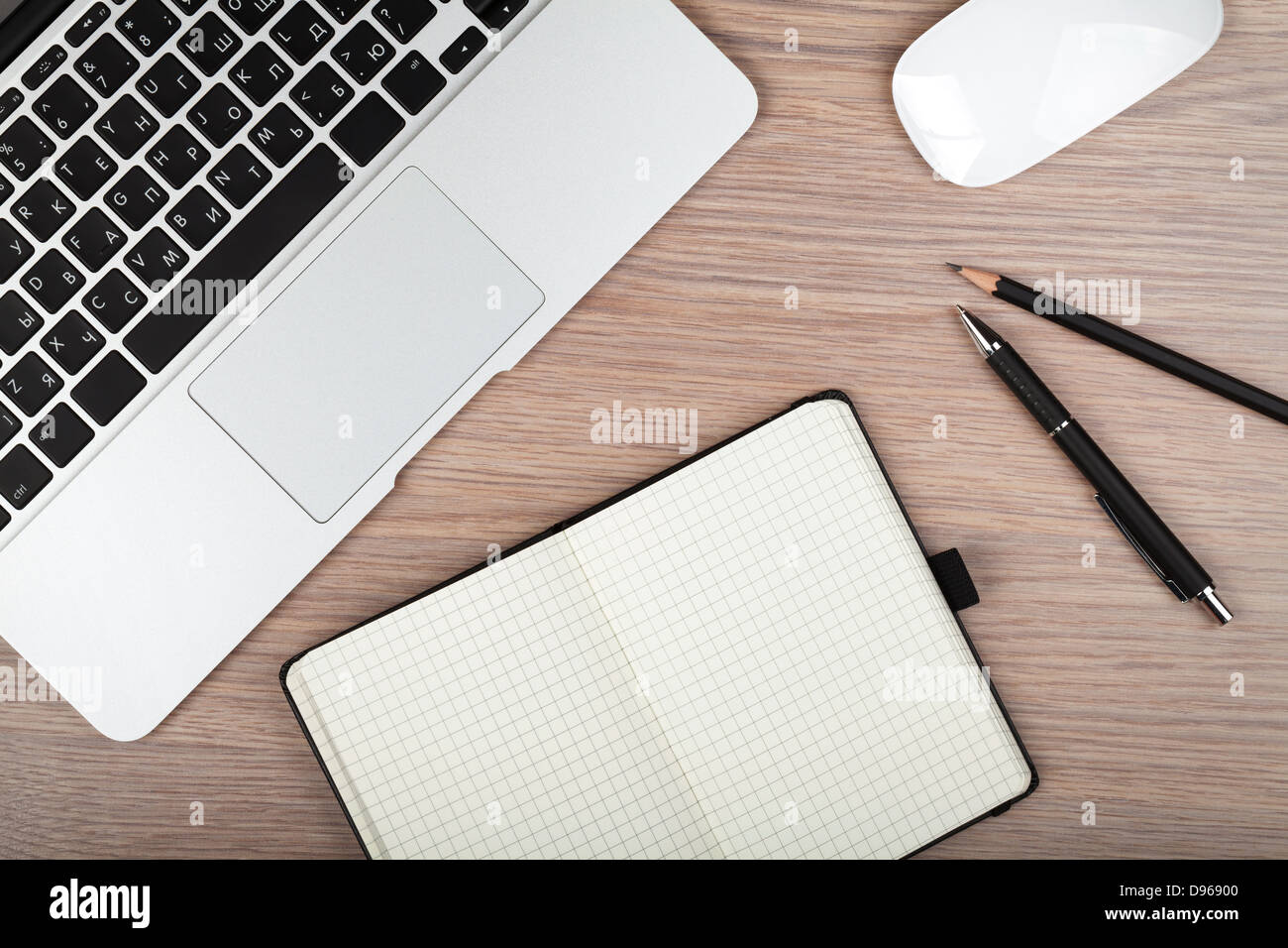 Notepad and laptop on wood table. View from above Stock Photo - Alamy