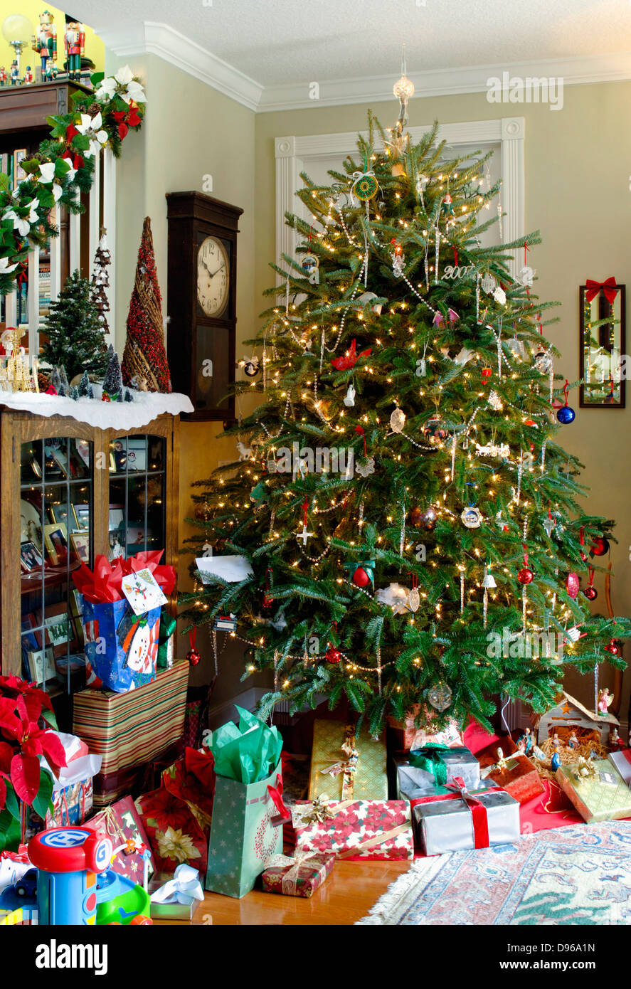 Gift boxes with decorated Christmas tree Stock Photo - Alamy