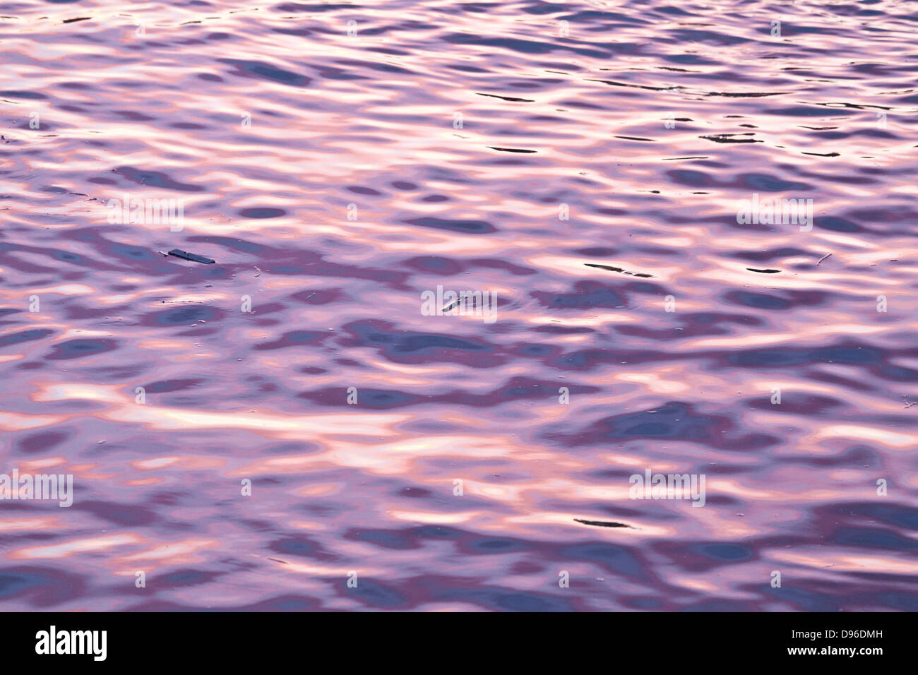 Water background with smooth ripples during sunset Stock Photo - Alamy