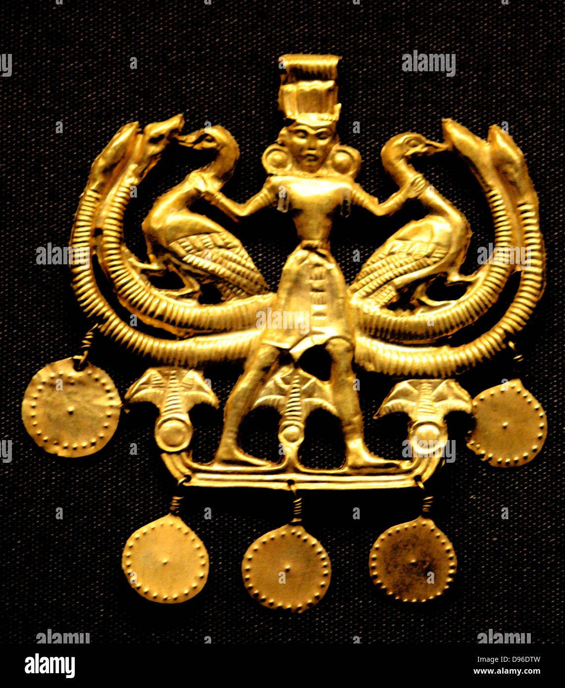 Sheet gold pendant showing a Cretan nature god, The figure wears a ...