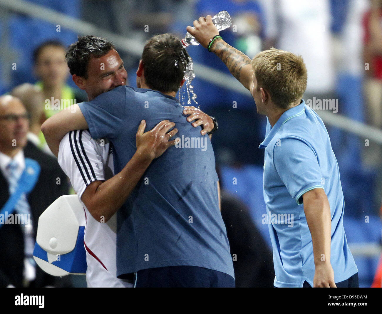 Lewis Holtby (R) of Germany celebrates with staff members after winning ...