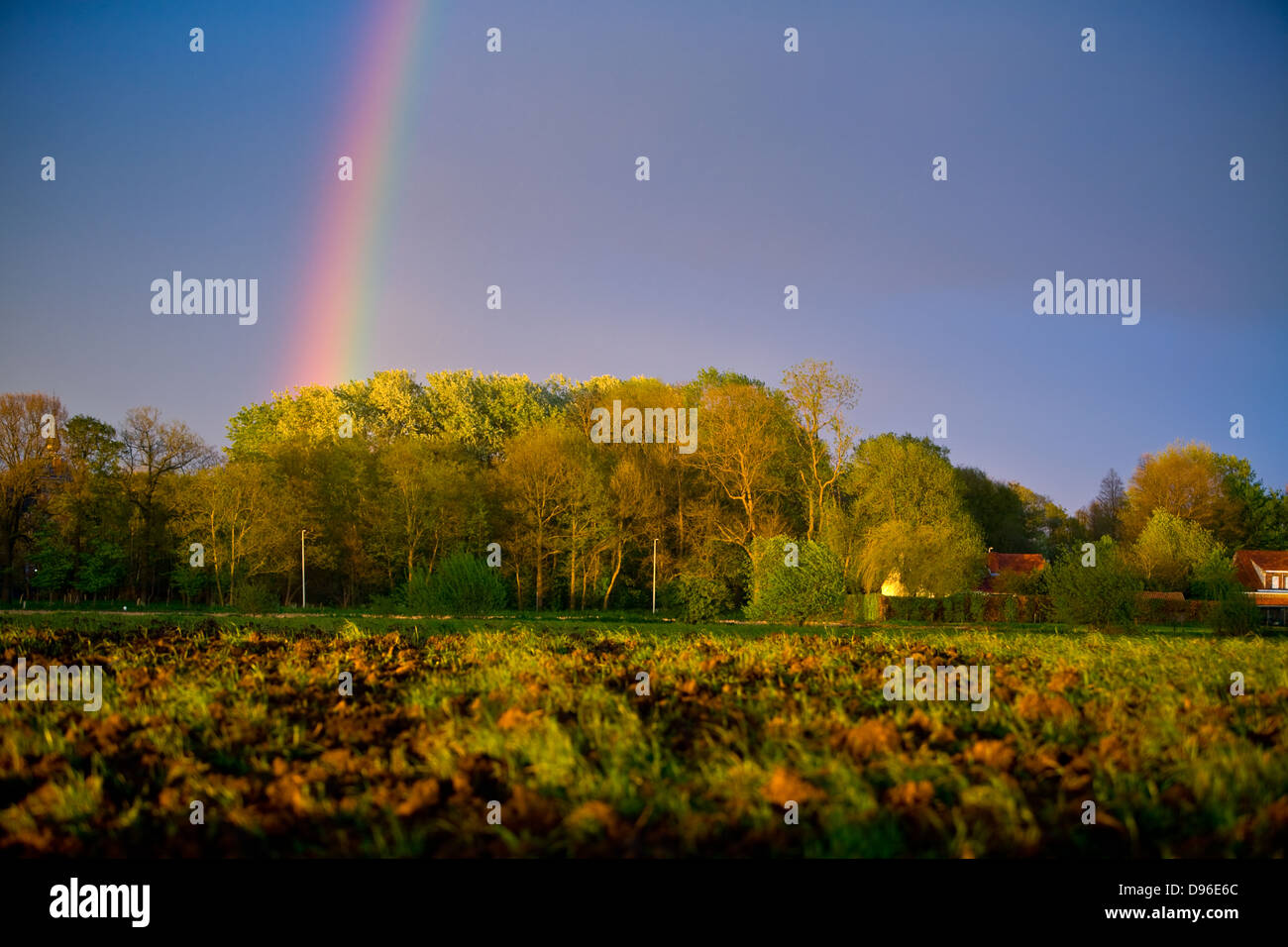 Rainbow showing in the sky above a rural area Stock Photo - Alamy