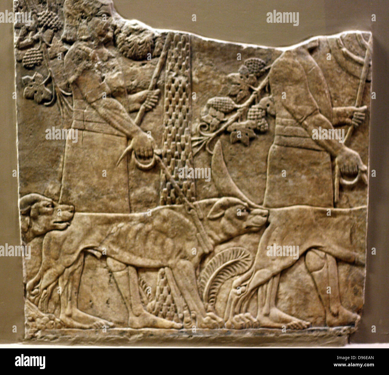 Wall panel depicting huntsmen with hounds in a garden. Assyrian, approx ...