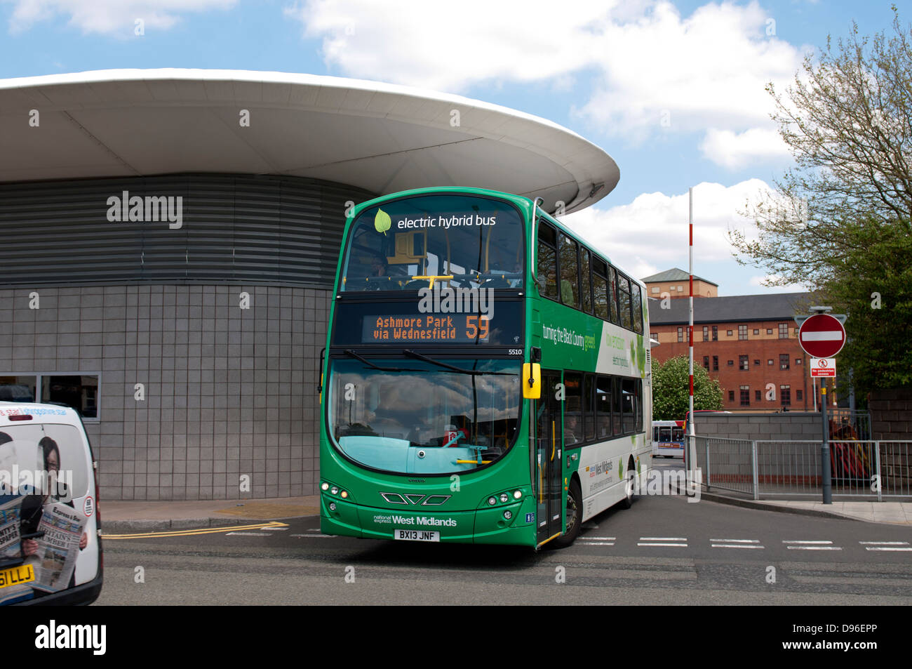 Electric hybrid bus leaving Wolverhampton bus station, West Midlands ...