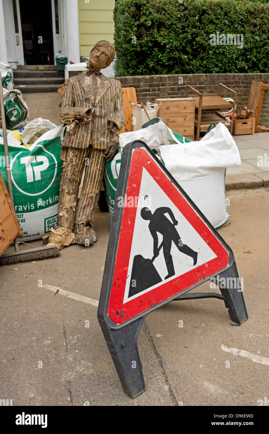 Men Working road sign Stock Photo - Alamy
