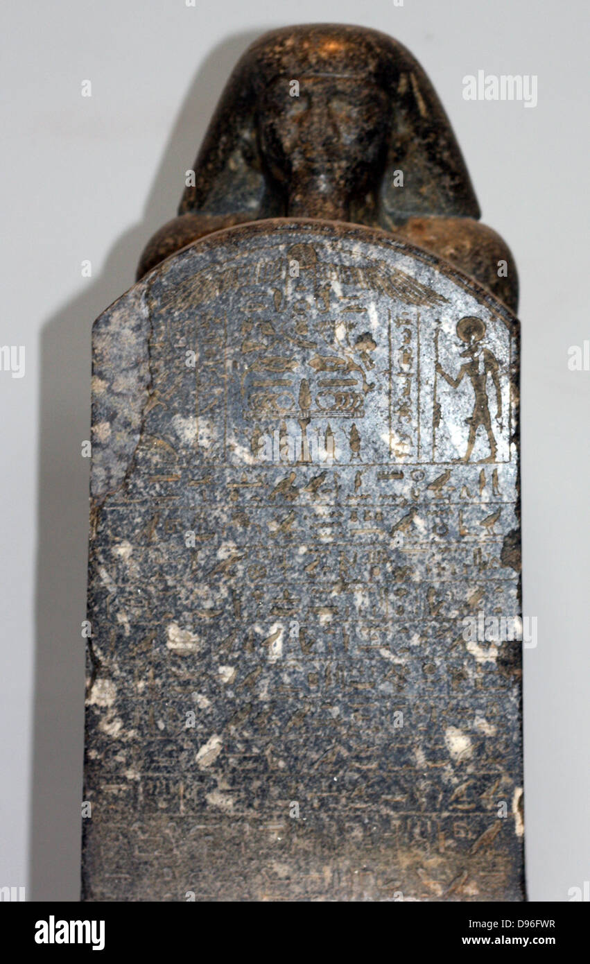 Statue of Montuemhat kneeling and holding up a stele. 25th or 26th ...