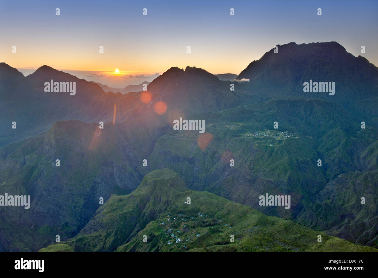 The sun rising over the Cirque de Mafate caldera on the French island ...