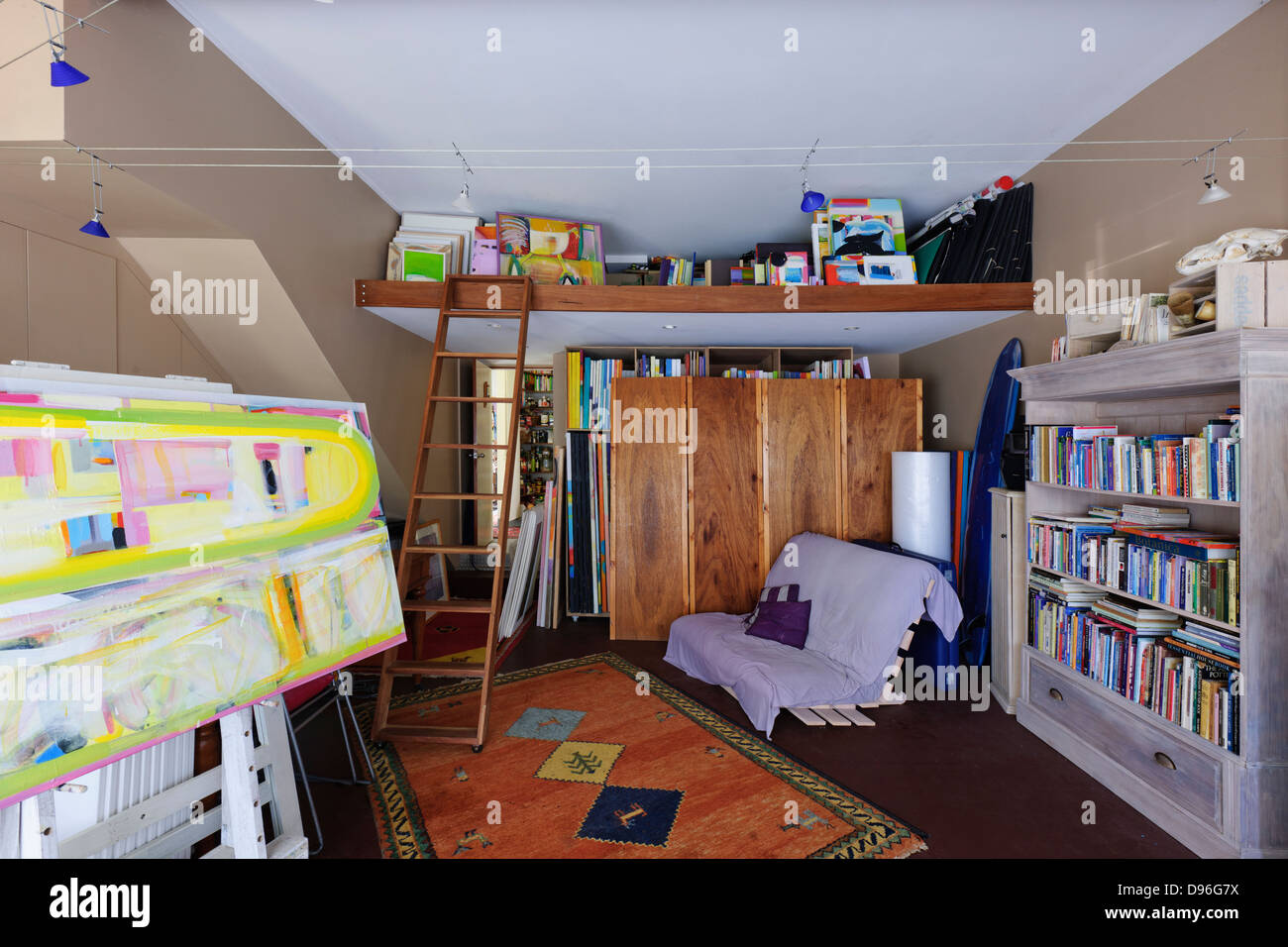 Interior of room with ladder, seat and shelves Stock Photo - Alamy