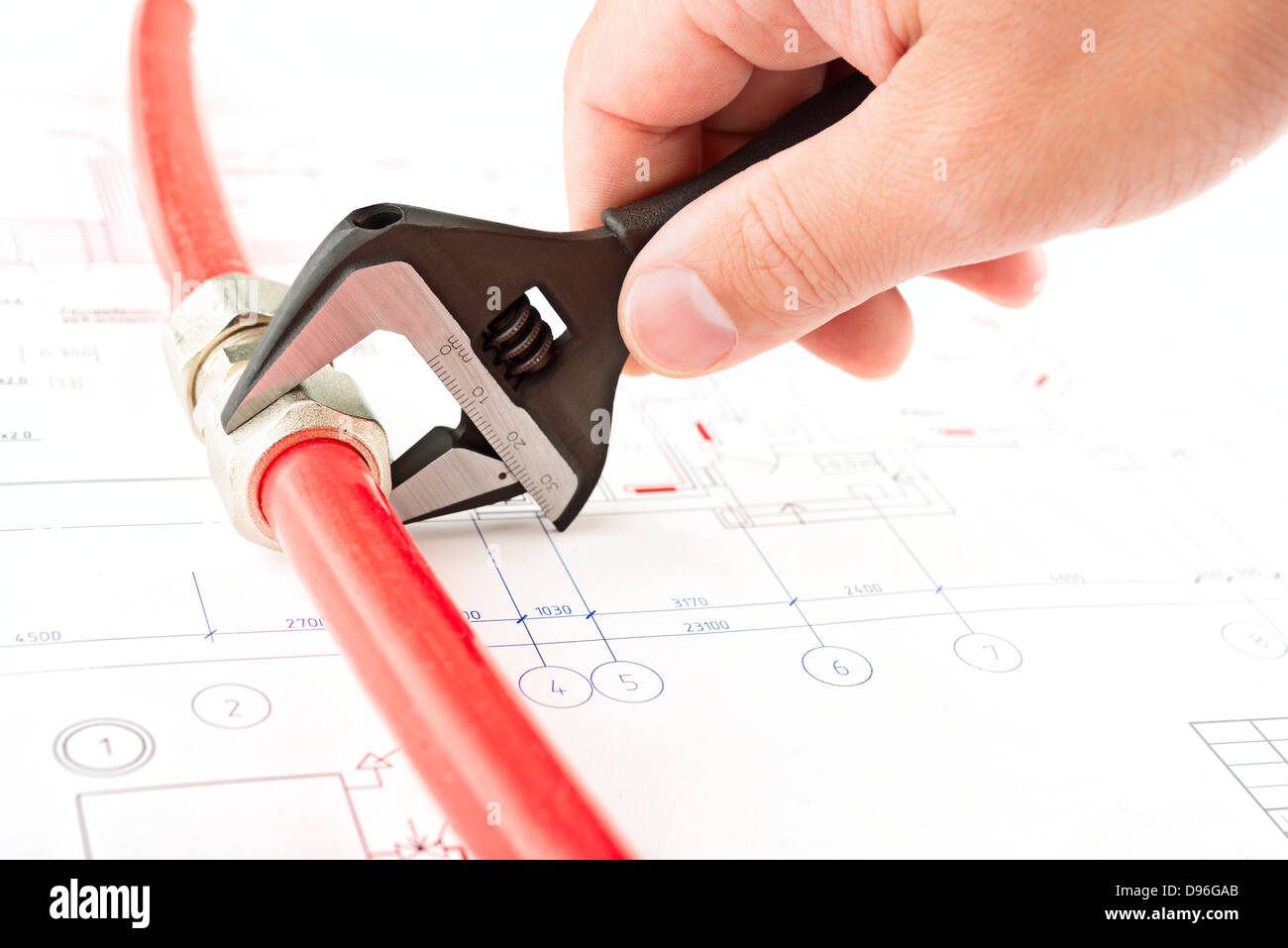 Men hands with spanner connect a pipe Stock Photo - Alamy