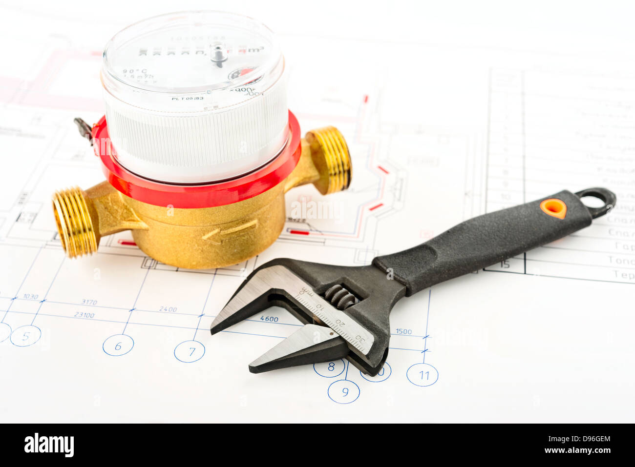spanner and water counter on a draft background Stock Photo - Alamy