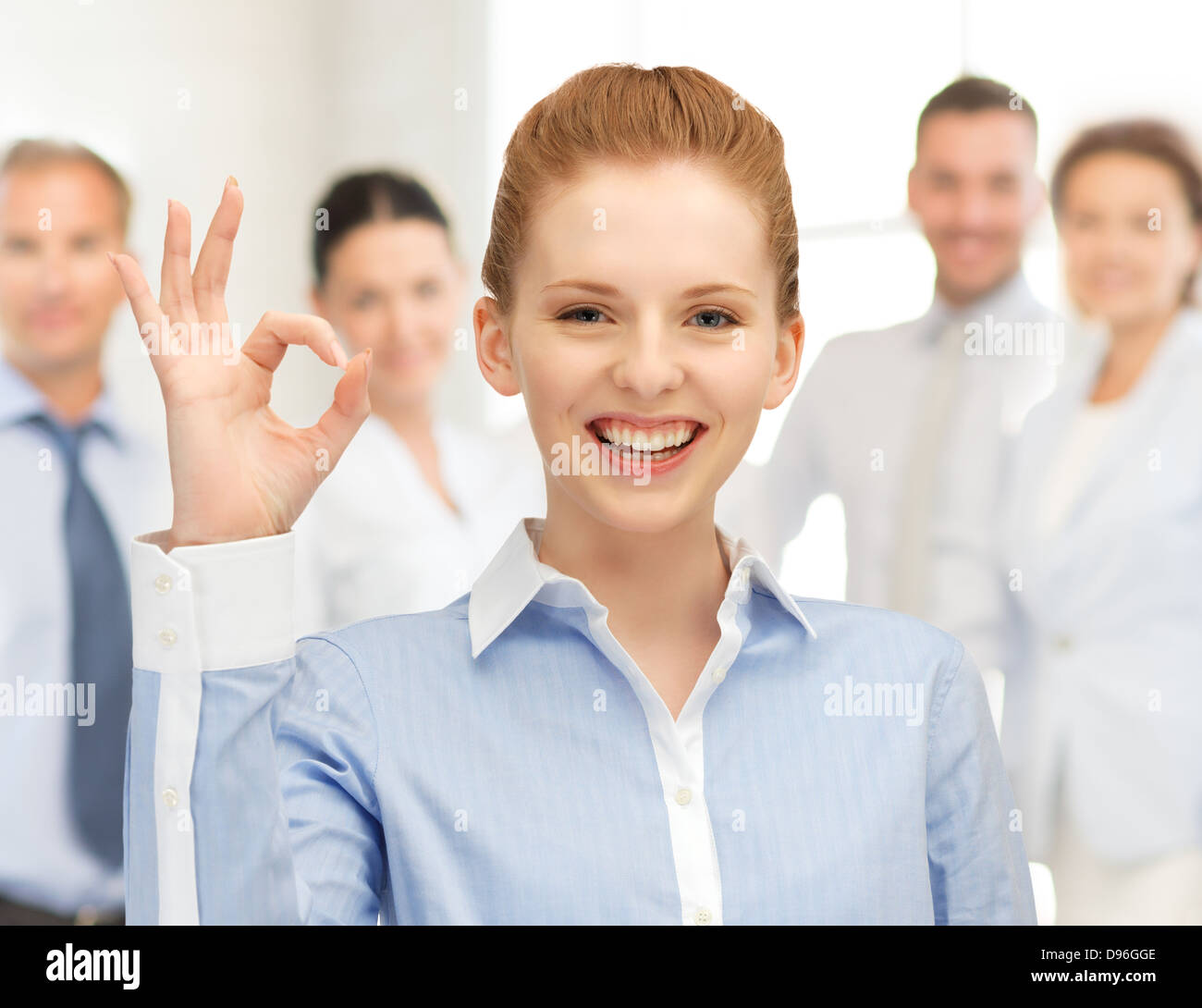 young woman showing ok sign Stock Photo - Alamy