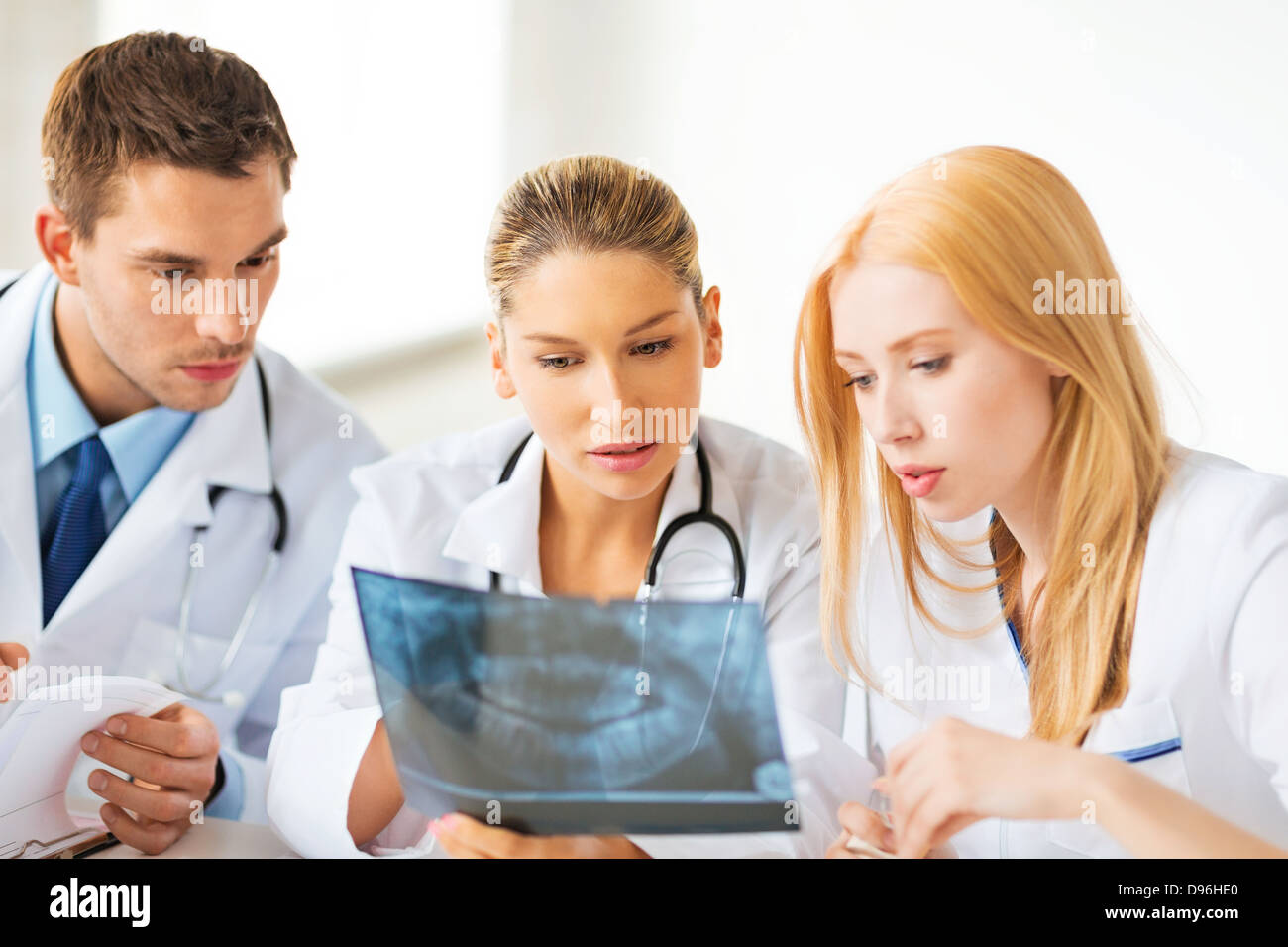 young group of doctors looking at x-ray Stock Photo - Alamy