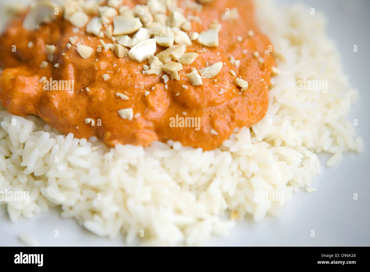 Homemade prawn Makhani with rice and chopped cashew nuts Stock Photo ...