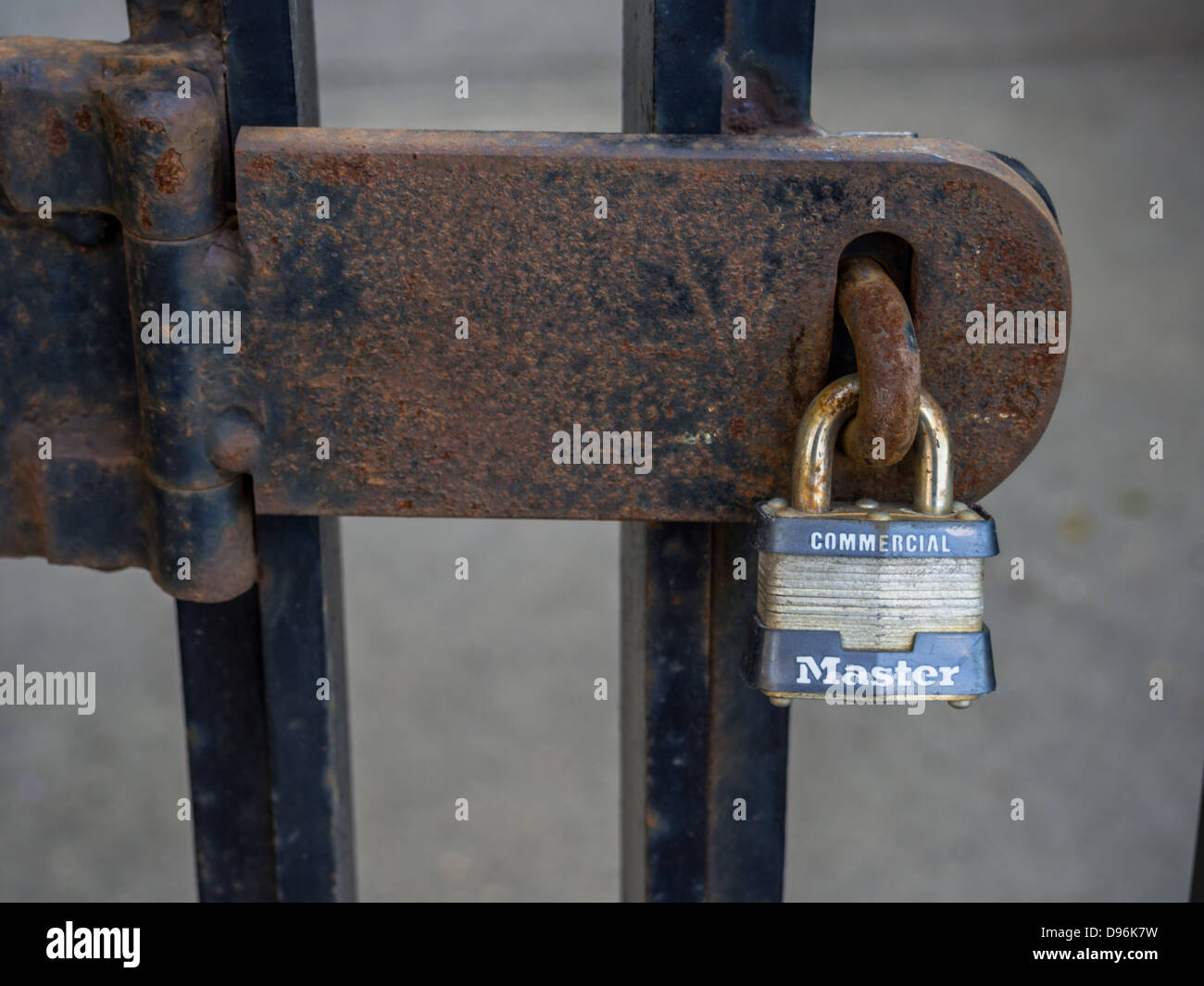 rusted Master lock on iron gate Stock Photo - Alamy