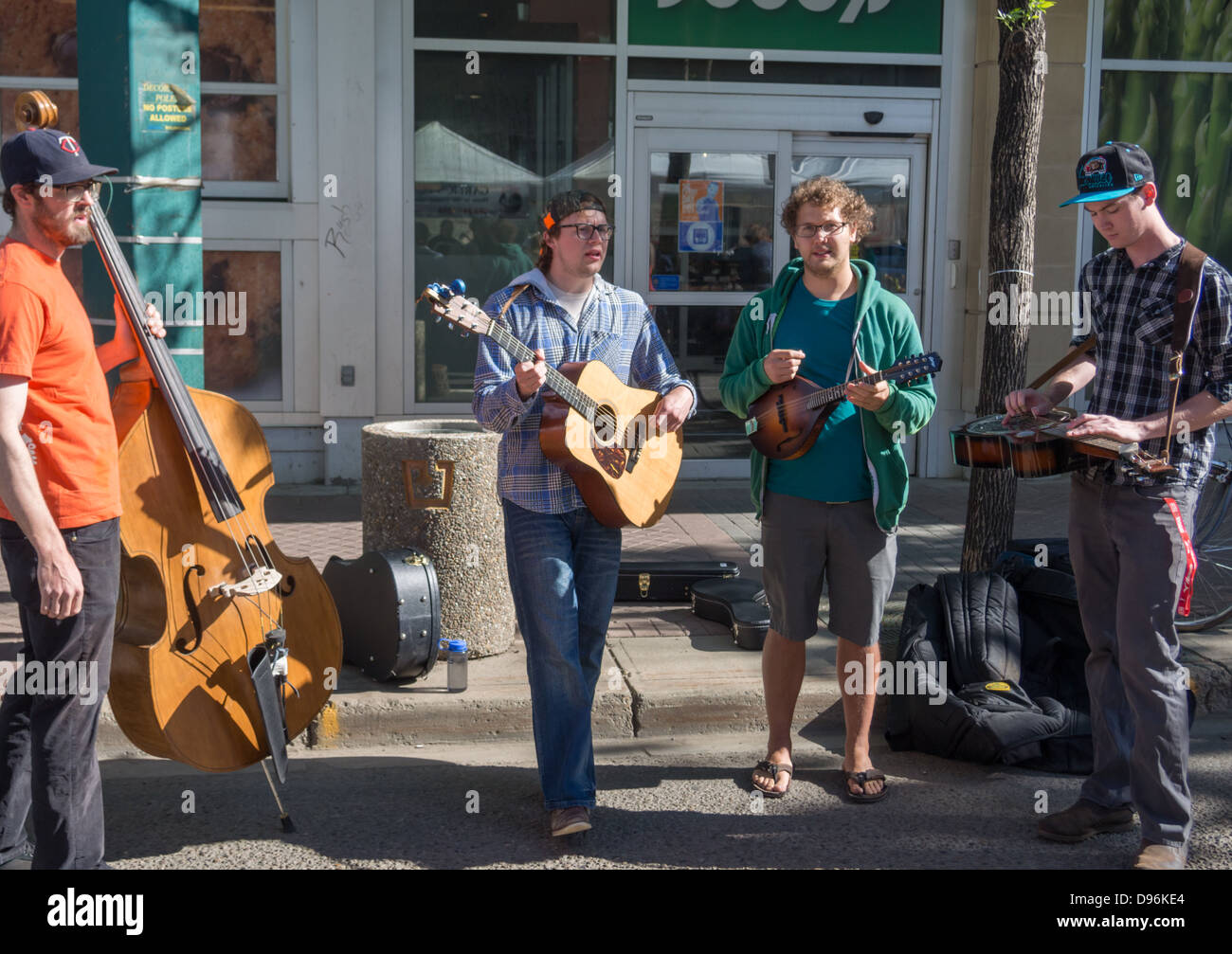 four men band playing on the street in downtown Edmonton Stock Photo ...