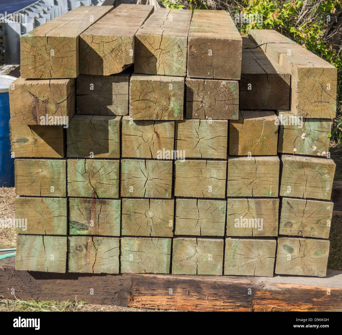pile of stacked wood posts Stock Photo - Alamy