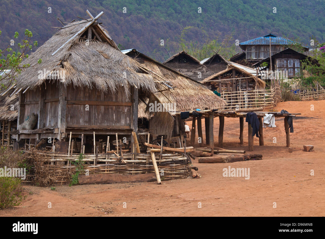 Houses in a typical AKHA village near KENGTUNG also known as KYAINGTONG ...