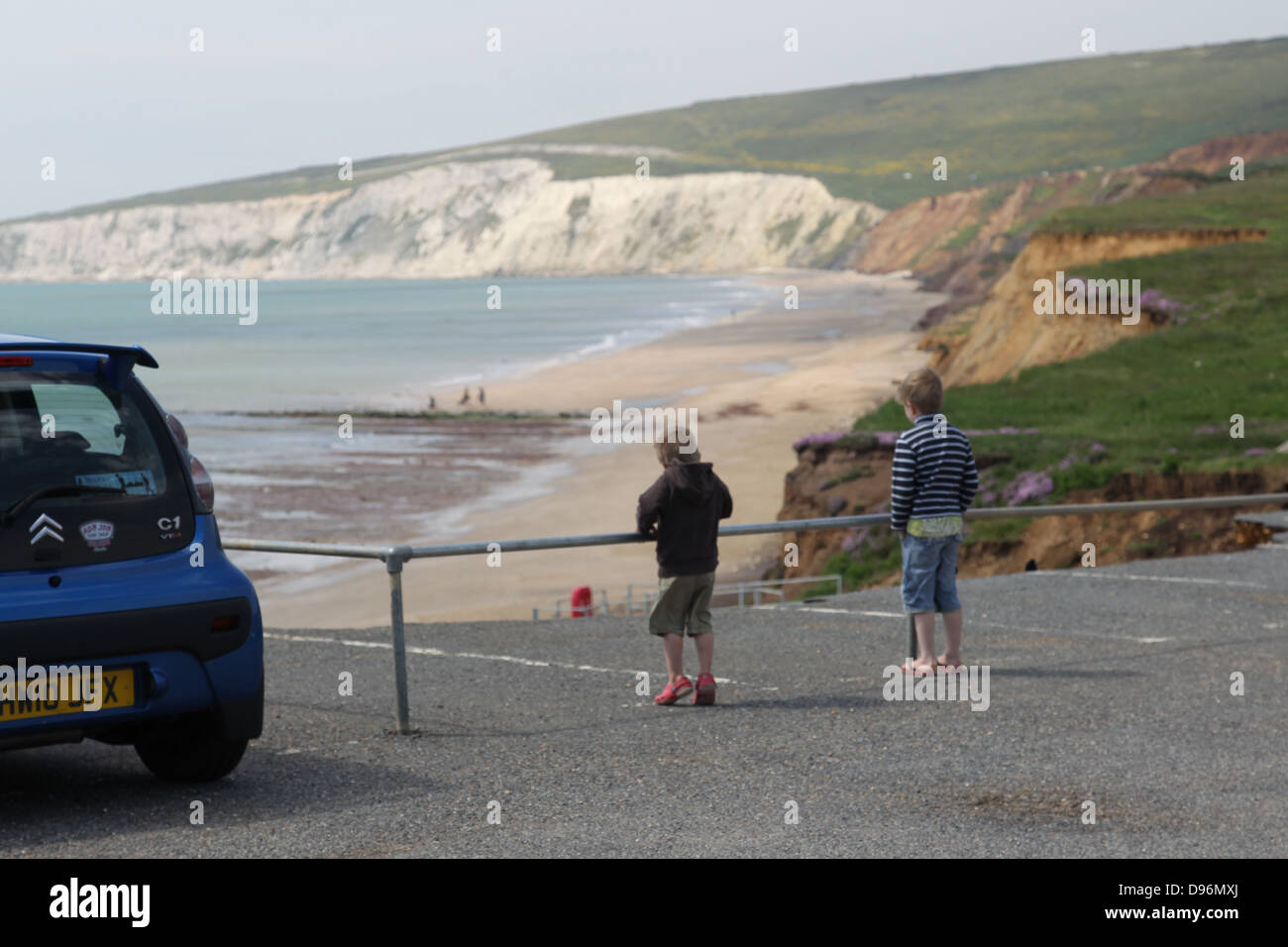 Compton Bay car park showing erosion and collapse. Children play near ... Compton Bay car park showing erosion and collapse. Children play near ...