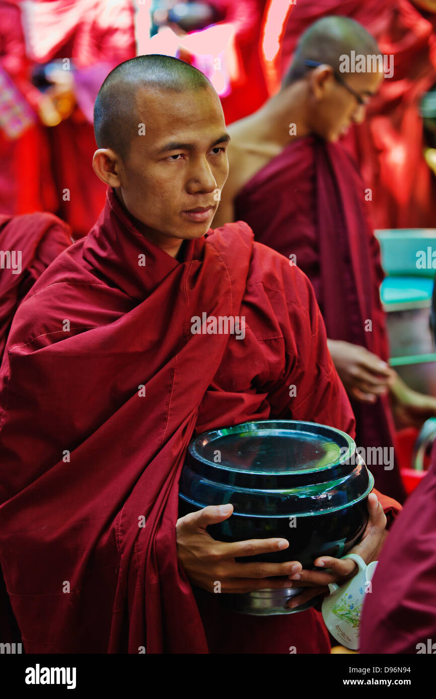 BUDDHIST MONKS are fed each day at 11 AM at the MAHAGANDAYON MONASTERY ...