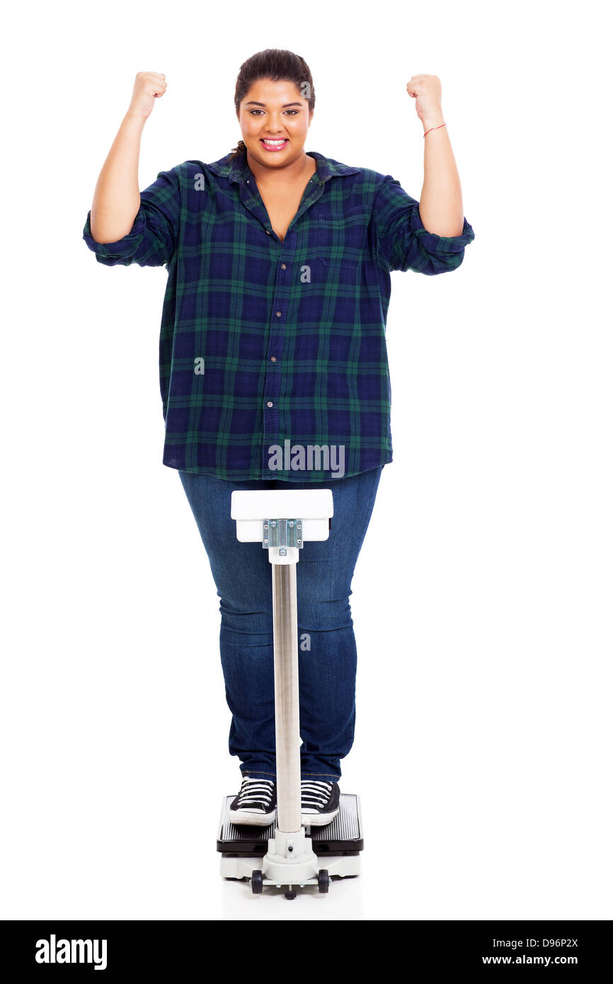happy overweight woman waving fists when noticed she lost some weight ...