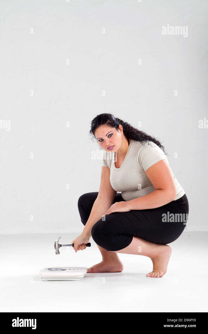 Obese black woman scale hi-res stock photography and images - Alamy